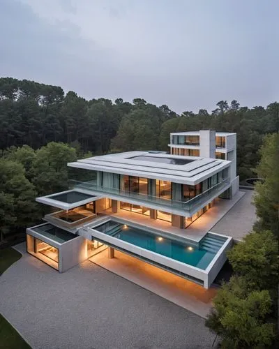 a very modern looking building with glass on it